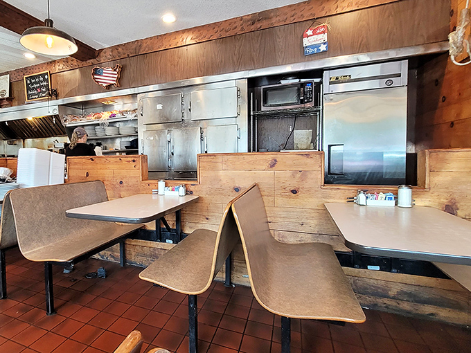 These booths have heard more Arkansas stories than a local historian. The worn seats are badges of honor in the breakfast battlefield.
