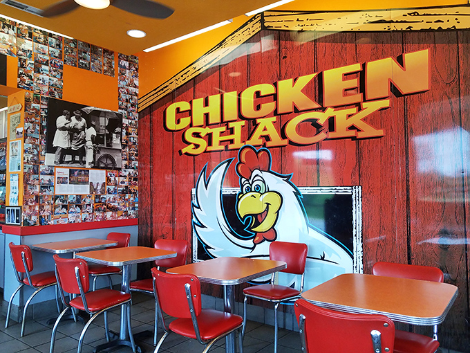 The cartoon chicken mascot watches over diners like a friendly poultry guardian angel, promising deliciousness in every bite.