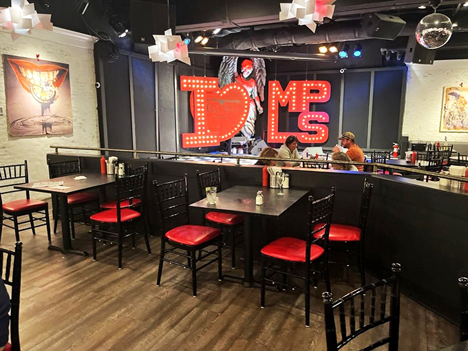 Where the devil is in the details: Black tables with red chairs create the perfect backdrop for culinary adventures in this underworld of flavor.