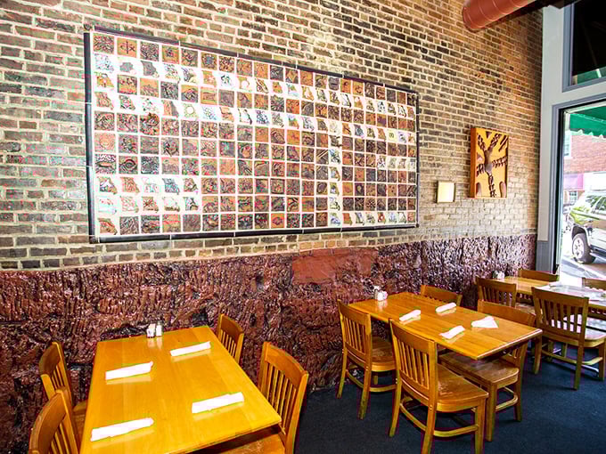 The wall art creates conversation while the tables create community&mdash;this isn't dining, it's a Midwestern social institution with better-than-average lighting.
