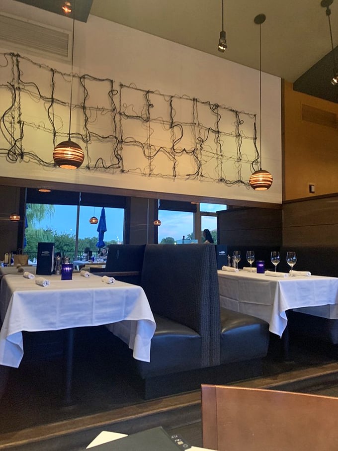 Private dining areas separated by wooden panels offer intimacy without isolation&mdash;perfect for celebrations or Tuesday night splurges. 