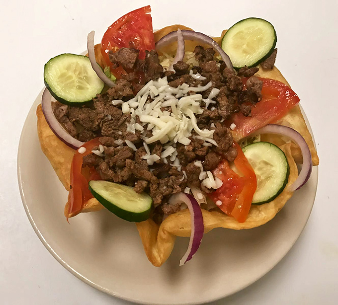 This taco salad breaks free from its tortilla bowl prison—a rebellion of seasoned beef, fresh vegetables, and cheese that makes salad feel like an indulgence.