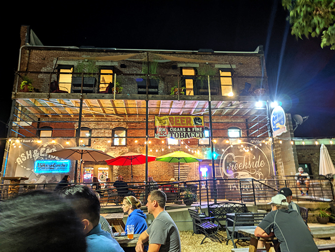 Night transforms ordinary brick walls into a magical backdrop for what truly matters &ndash; friends gathering over craft beers under string lights and starry skies.