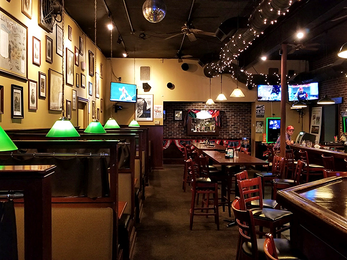 Green-shaded lamps cast a warm glow over wooden booths &ndash; creating an atmosphere where strangers become friends and friends become regulars.