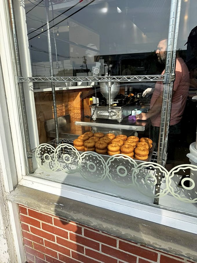 Fresh batches visible through the window &ndash; a delicious tease for those waiting outside. Like watching a Broadway show from the sidewalk.