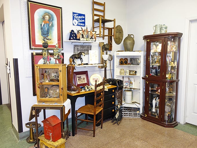 "Curated chaos that somehow makes perfect sense." Every shelf tells multiple stories&mdash;dolls from the 1950s neighbor vintage kitchenware while military memorabilia stands at attention nearby.