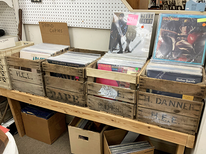 Vinyl records in wooden crates &ndash; the way music was meant to be browsed. Each scratch and pop is a badge of honor.