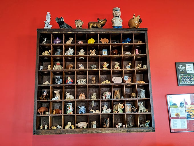 The pig figurine collection isn't just decoration&mdash;it's a shrine to the animal that makes this culinary pilgrimage necessary in the first place.