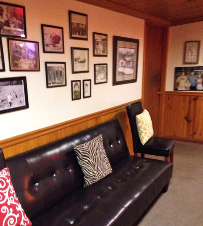 The wall of memories tells stories of good times past, while comfortable seating invites you to create your own Taylor's chapter.