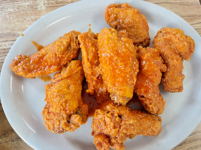 Wings so golden and crispy they deserve their own country music ballad. They don't fly anymore, but they'll send your taste buds soaring.
