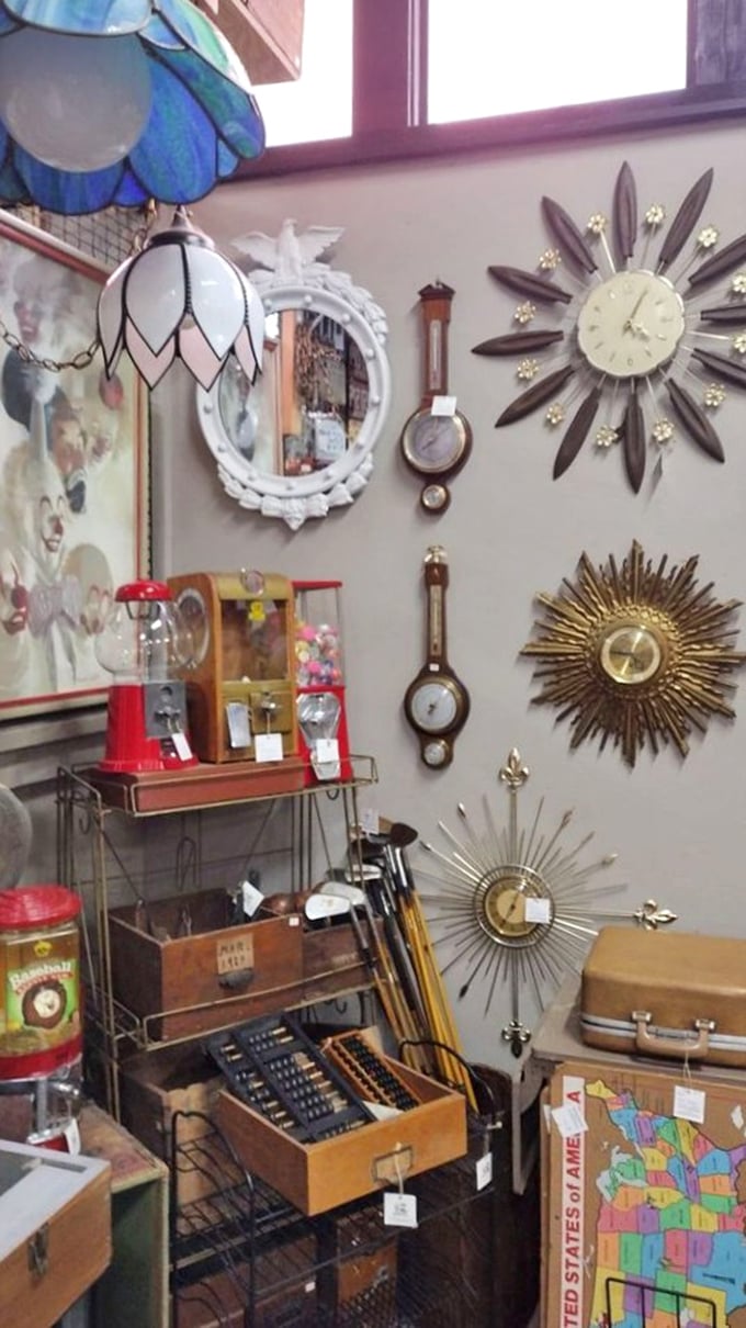 A wall where time literally stands still, with mid-century sunburst clocks playing rhythm section to ornate barometers and pendulum pieces.