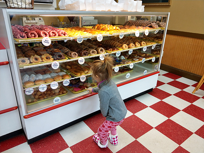 Childhood wonder captured perfectly &ndash; when your eye level is exactly the same height as donut paradise.