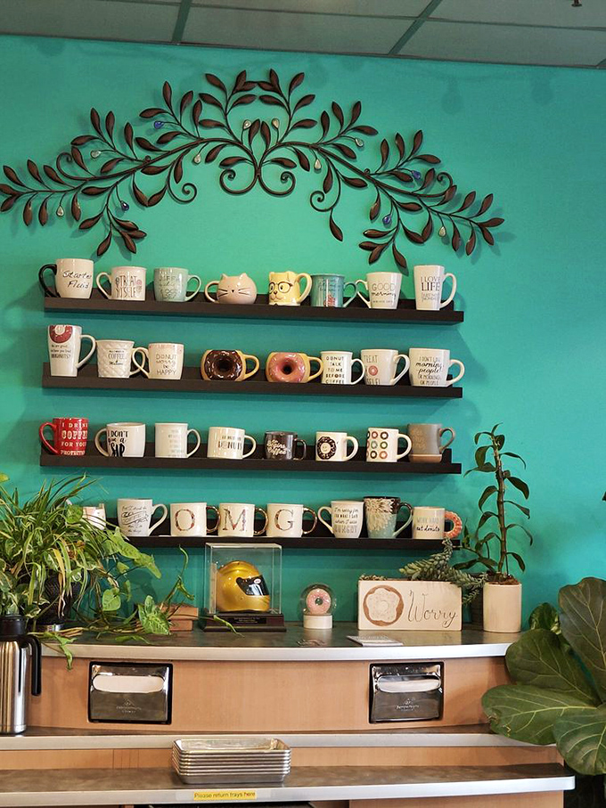 The mug collection wall&mdash;where coffee vessels are displayed like trophies commemorating victories in the battle against morning grumpiness.