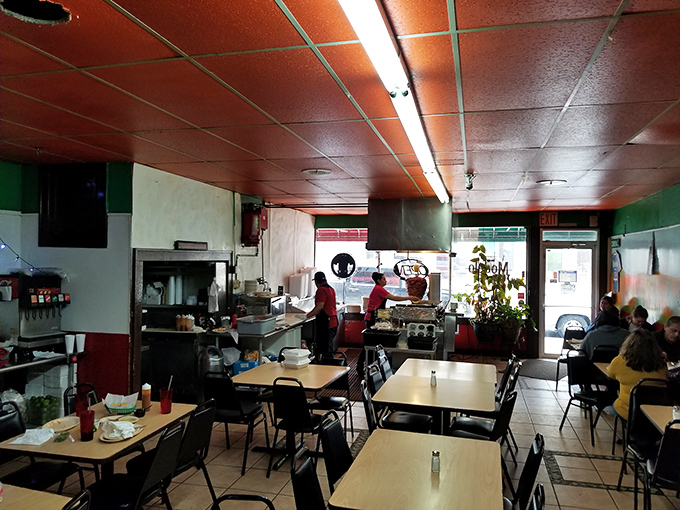 Where culinary magic happens daily. Those ceiling tiles have witnessed countless first-bite expressions of pure joy from unsuspecting Kansas City diners.