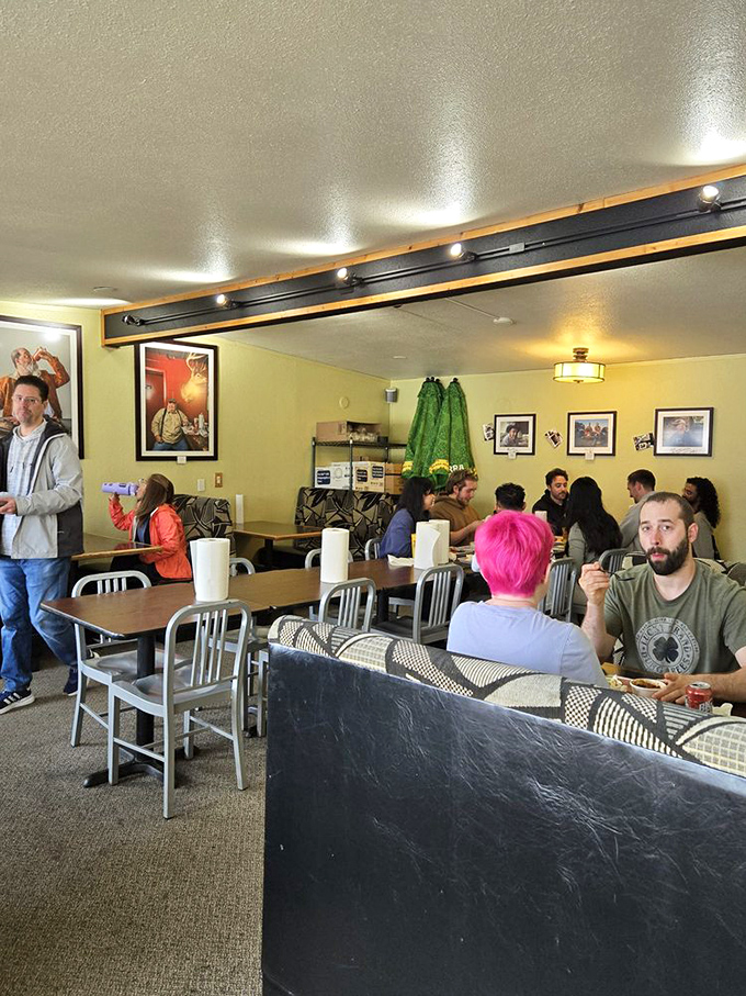 The dining room hums with the universal language of barbecue appreciation. Notice the focused expressions&mdash;that's what meat meditation looks like.