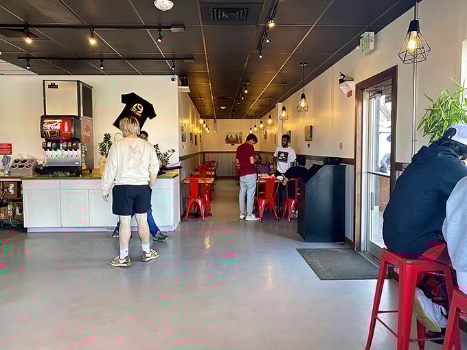 The pilgrimage to chicken paradise involves a brief wait at the counter. Notice the focused expressions &ndash; these are people on a mission.