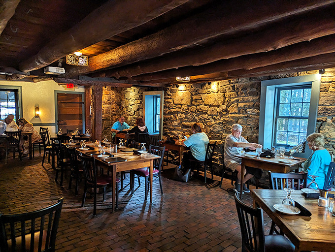 The dining room where history happens three times daily, plus happy hour. Those exposed stone walls have heard more secrets than a small-town barber.