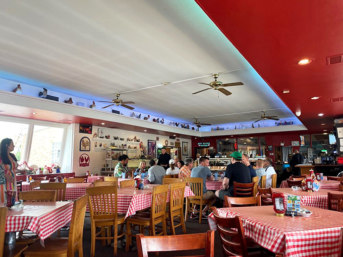 The dining room buzzes with conversation and clinking silverware. Those red-checkered tablecloths have witnessed decades of first bites and satisfied sighs.