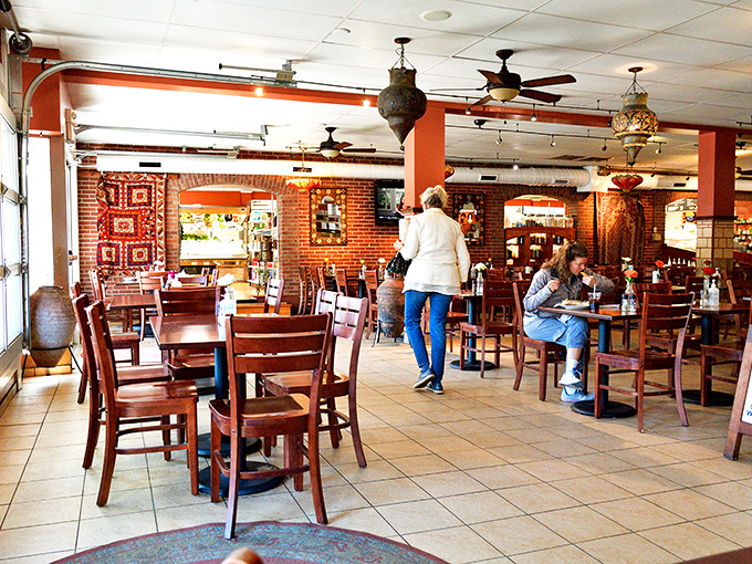 The dining room where strangers become friends over shared plates and where diet plans go to die happy, satisfied deaths.