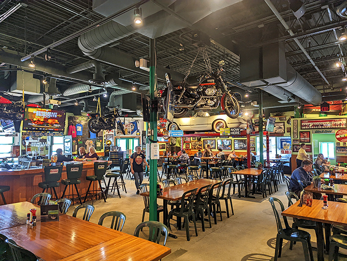 The dining room feels like the world's most comfortable garage, where automotive memorabilia creates a backdrop for conversations that flow as easily as the drinks.