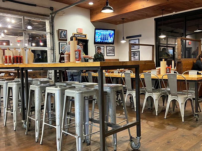 The dining room buzzes with the energy of barbecue pilgrims who've found their promised land among wooden beams and metal stools.