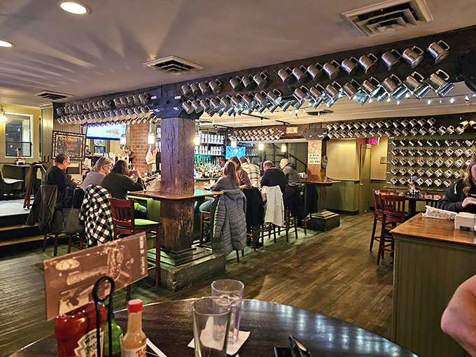 The bar area hums with conversation and clinking glasses, where strangers become friends over shared appreciation of good drinks.
