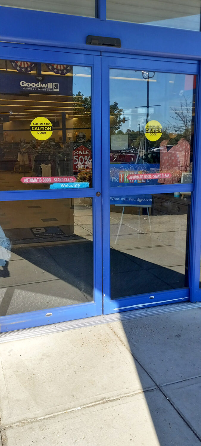 Blue automatic doors&mdash;the portal between ordinary life and the parallel universe of secondhand treasures within.