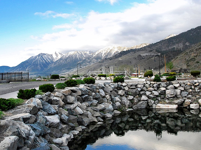 The Sierra Nevada mountains stand like nature's fortress wall behind Genoa, their snow-capped peaks a dramatic counterpoint to the desert below.