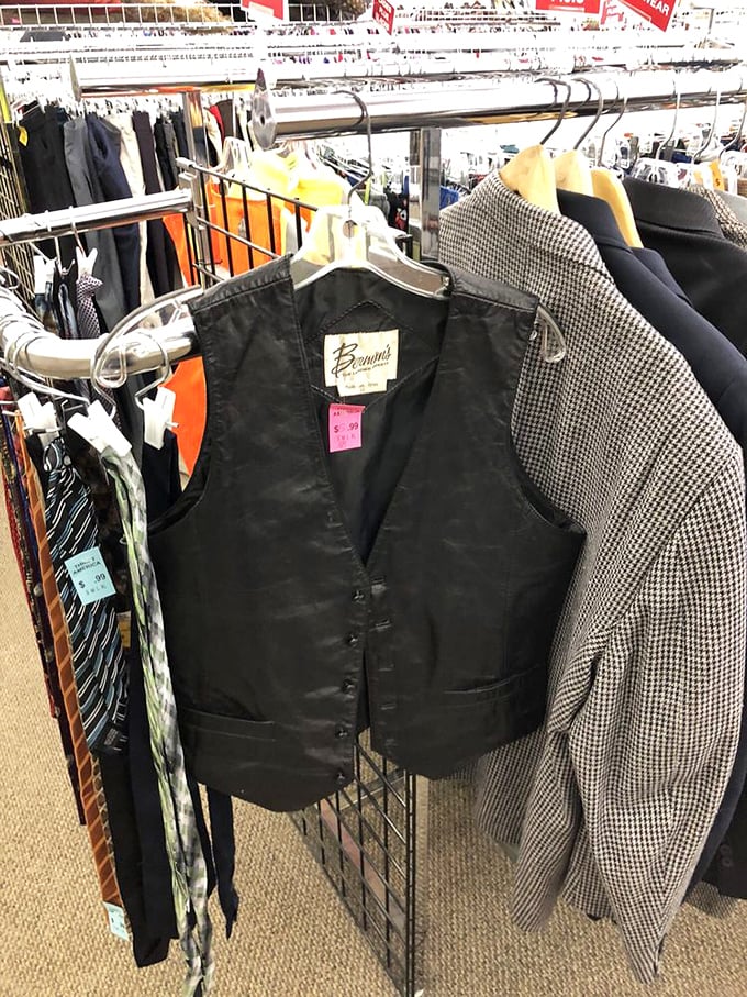 Leather vests hanging like patient sentinels, waiting for their second act. That Browning label whispers tales of quality craftsmanship.