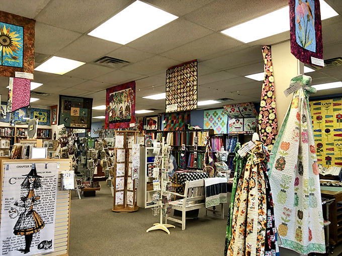 A quilter's cathedral where creativity is worshipped in all its colorful glory. Finished projects hang like stained glass windows.