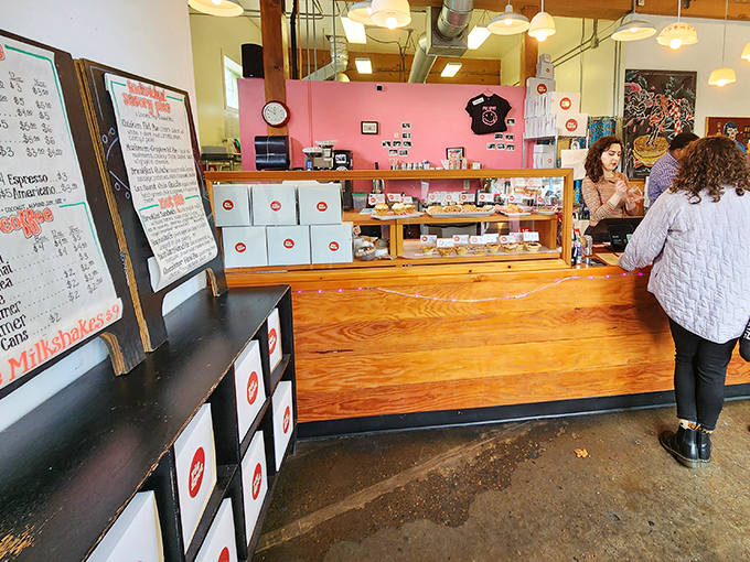 The pink wall and wooden counter create the perfect stage for pie artistry. Like watching skilled musicians, watching pie professionals is its own pleasure.