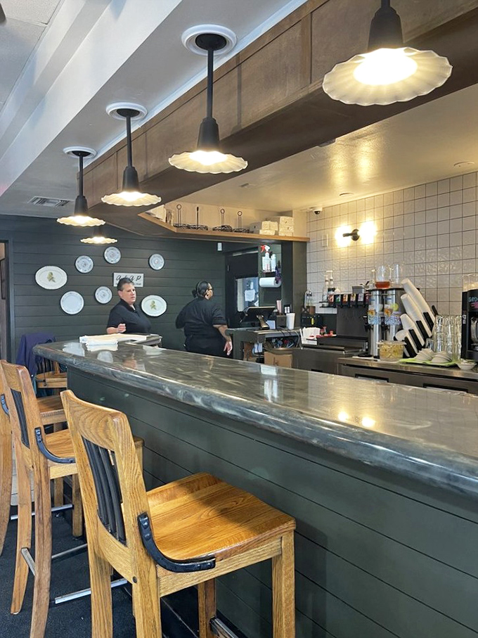 The heart of the operation where culinary magic happens. Those pendant lights have illuminated countless plates of Southern perfection on their journey to hungry diners.