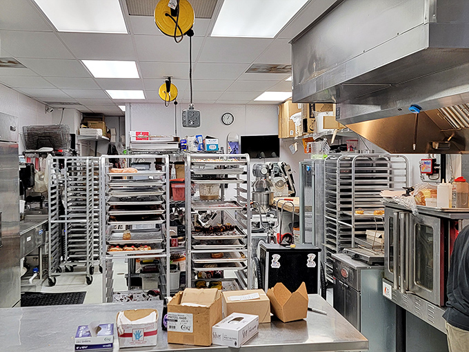 Behind the scenes in donut headquarters, where metal racks stand at attention, ready to transport freshly made miracles from oven to eager hands.
