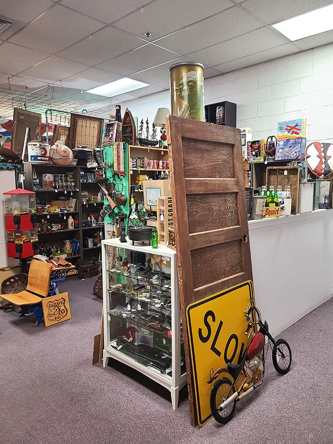 A wooden door leans casually against vintage treasures, like a portal waiting to transport you to another era.