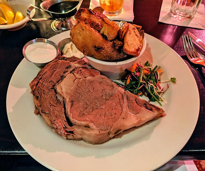 Prime rib so perfectly pink it makes flamingos envious, served with potatoes that have clearly lived their best possible potato life.