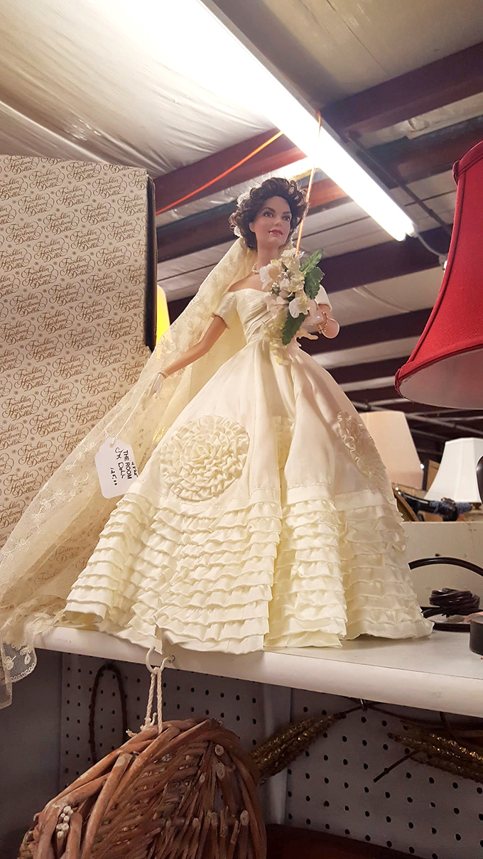 A Jacqueline Kennedy bridal doll in pristine condition, capturing American royalty in miniature. Camelot preserved under fluorescent lights.