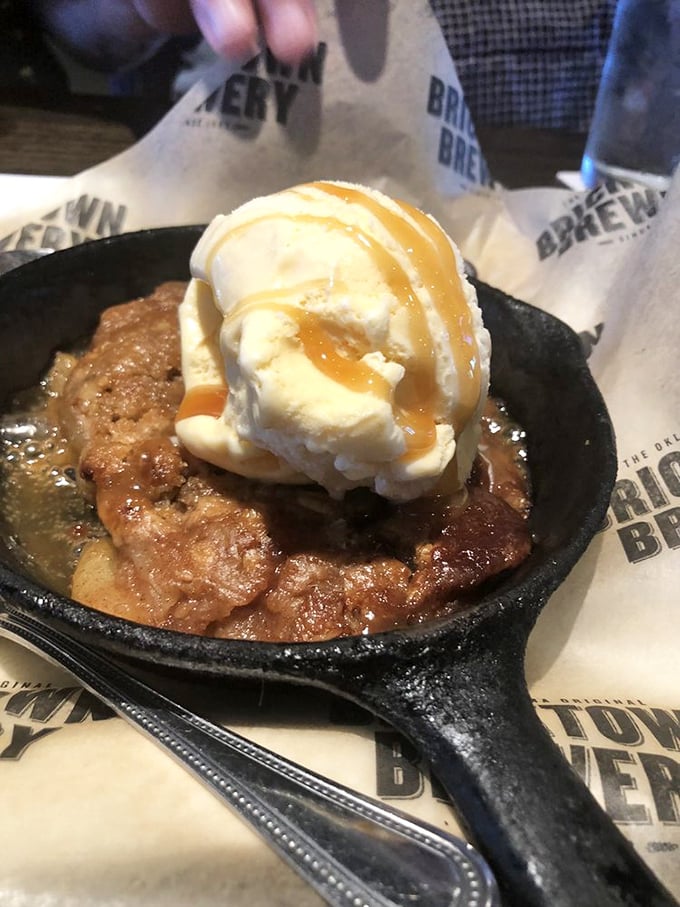 The skillet apple crisp arrives bubbling hot with vanilla ice cream slowly surrendering to the warm caramel below &ndash; a beautiful tragedy.