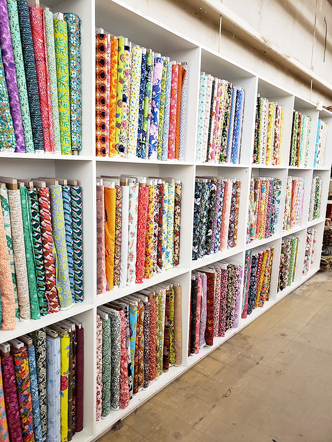 The shelving system here deserves its own engineering award. It's like the Library of Congress, but for fabric lovers.