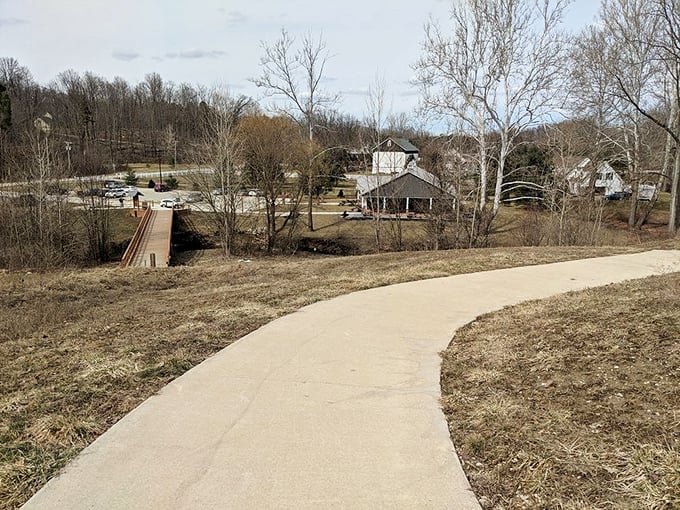 This winding path at Austin Badger Park practically begs you to follow it, promising adventure or at least a pleasant afternoon stroll.
