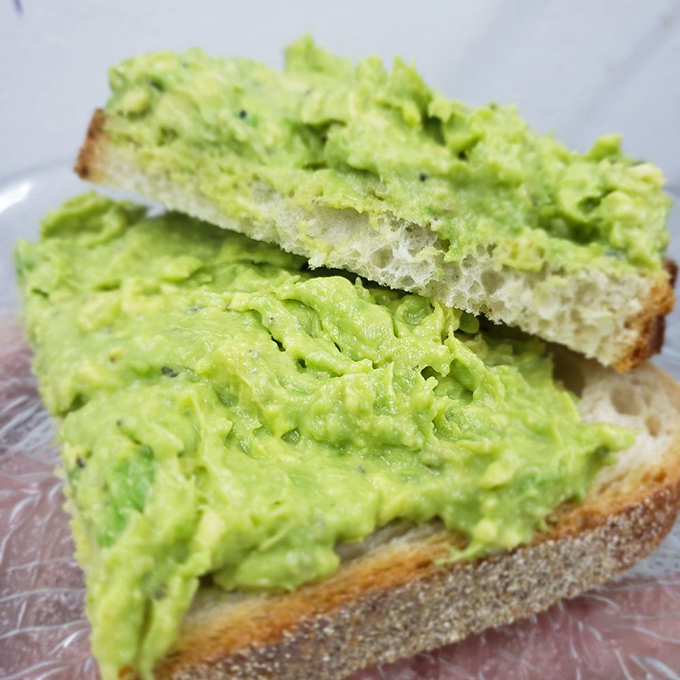 Avocado toast so vibrantly green it could single-handedly fund a Baby Boomer's retirement&mdash;and worth every penny.