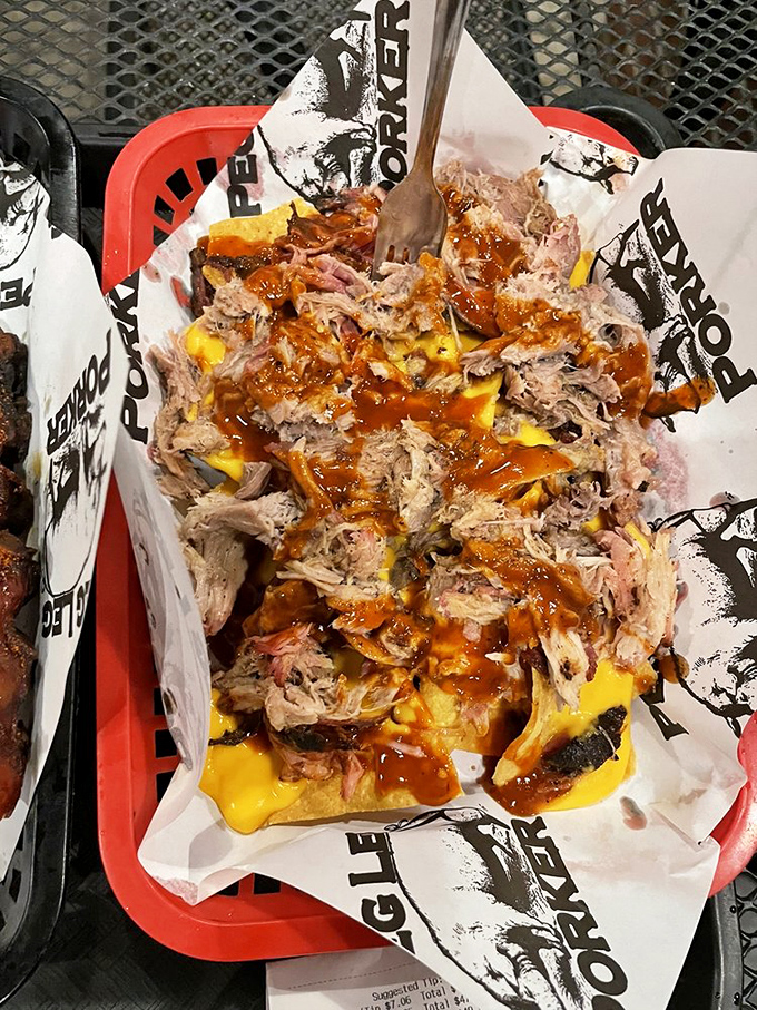 BBQ nachos that blur the line between appetizer and life-changing experience, topped with smoke-kissed pulled pork.