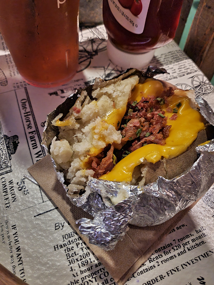 A baked potato that could feed a small village, butter melting into its fluffy interior like sunshine on a perfect day.