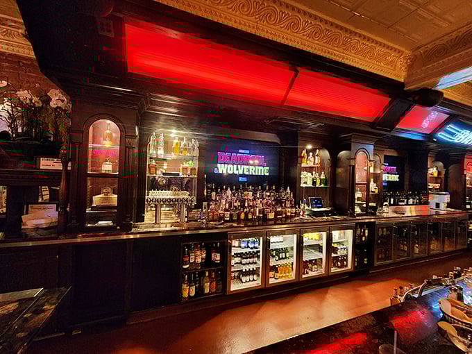 Not just a bar but a liquid landscape of possibilities illuminated with Michigan sports pride. Those refrigerators hold more dreams than beverages.