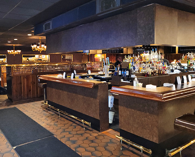 A proper bar should feel like both a sanctuary and a stage. This one says, "Your Manhattan will be perfect, and so will your evening."