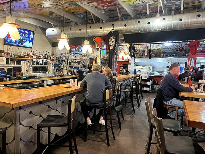The bar area balances rustic charm with urban energy&mdash;where strangers become friends over craft beers and shared pizza recommendations.
