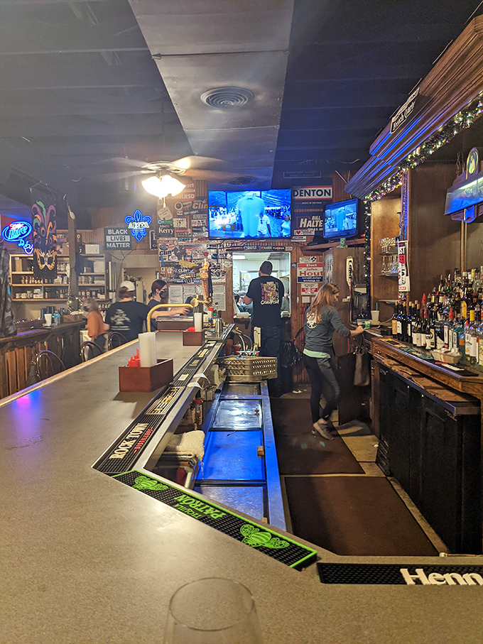 A bar that tells stories through neon signs and loyal patrons. This is where local legends are born, one cocktail at a time.