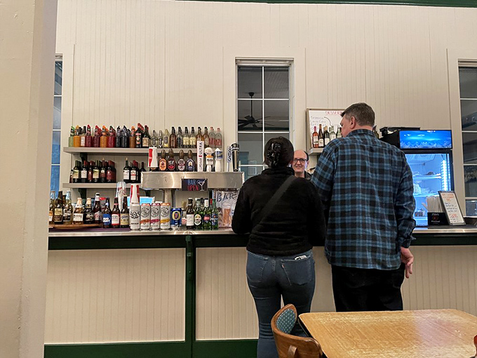 The bar area &ndash; where decisions are made, stories are shared, and nobody's counting how many times you visit the menu board.