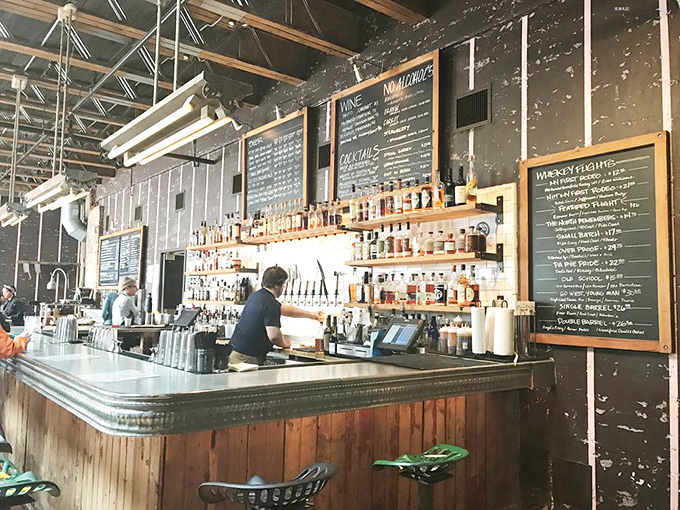 The bar: where whiskey bottles stand at attention like soldiers ready to complement your barbecue battle plan.