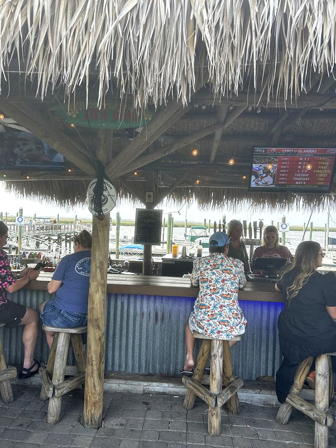 Tiki bar magic where memories are made. Those palm frond roofs aren't just for show&mdash;they're sheltering happiness in liquid form.