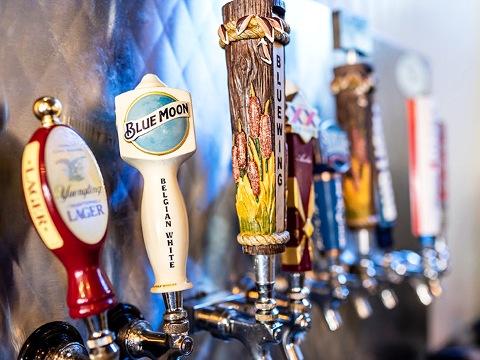 Beer taps that promise cold comfort after a long day. Each handle tells a story of craftsmanship, from local brews to national favorites, all flowing freely.